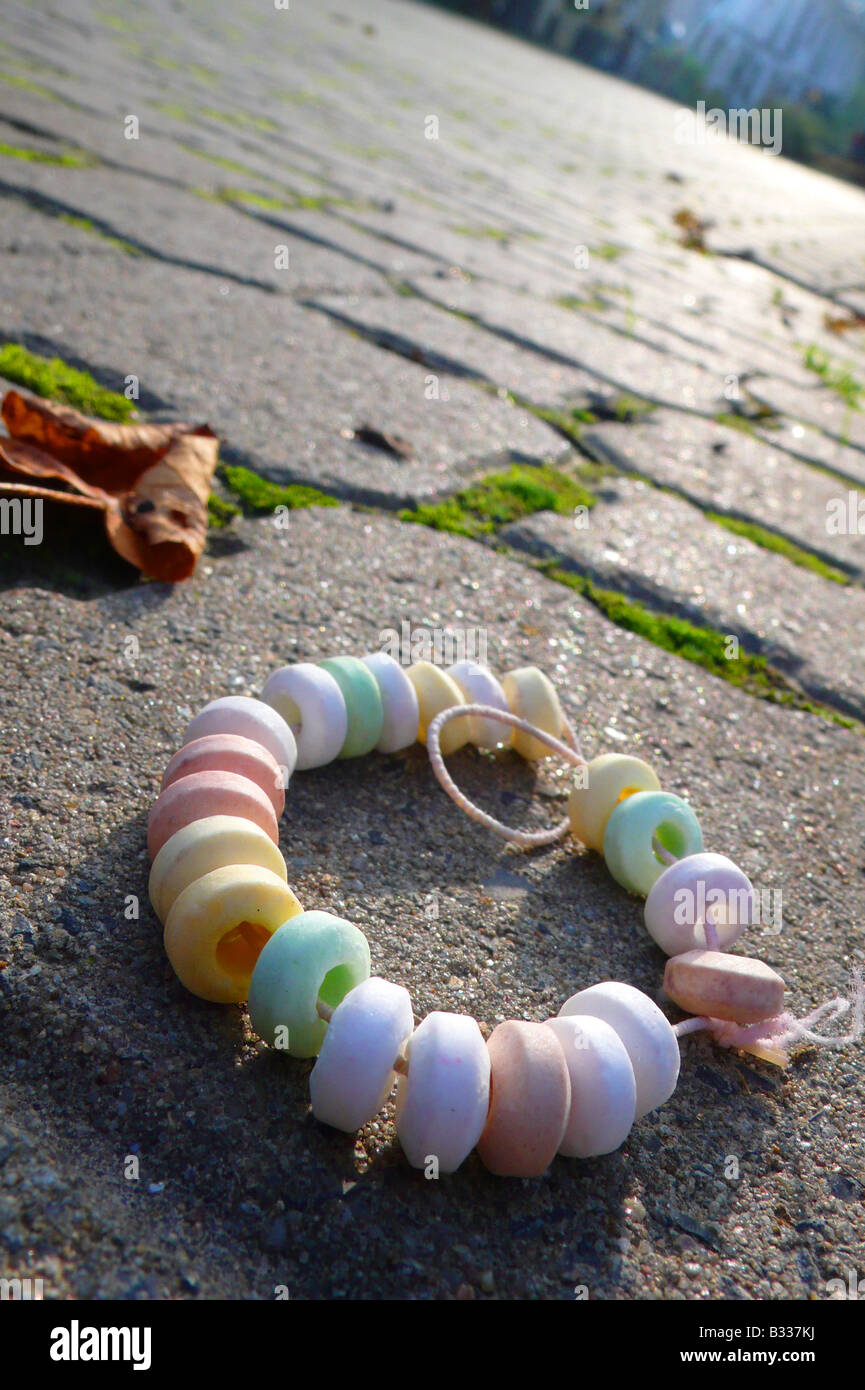 candy chain lying on the street Stock Photo - Alamy
