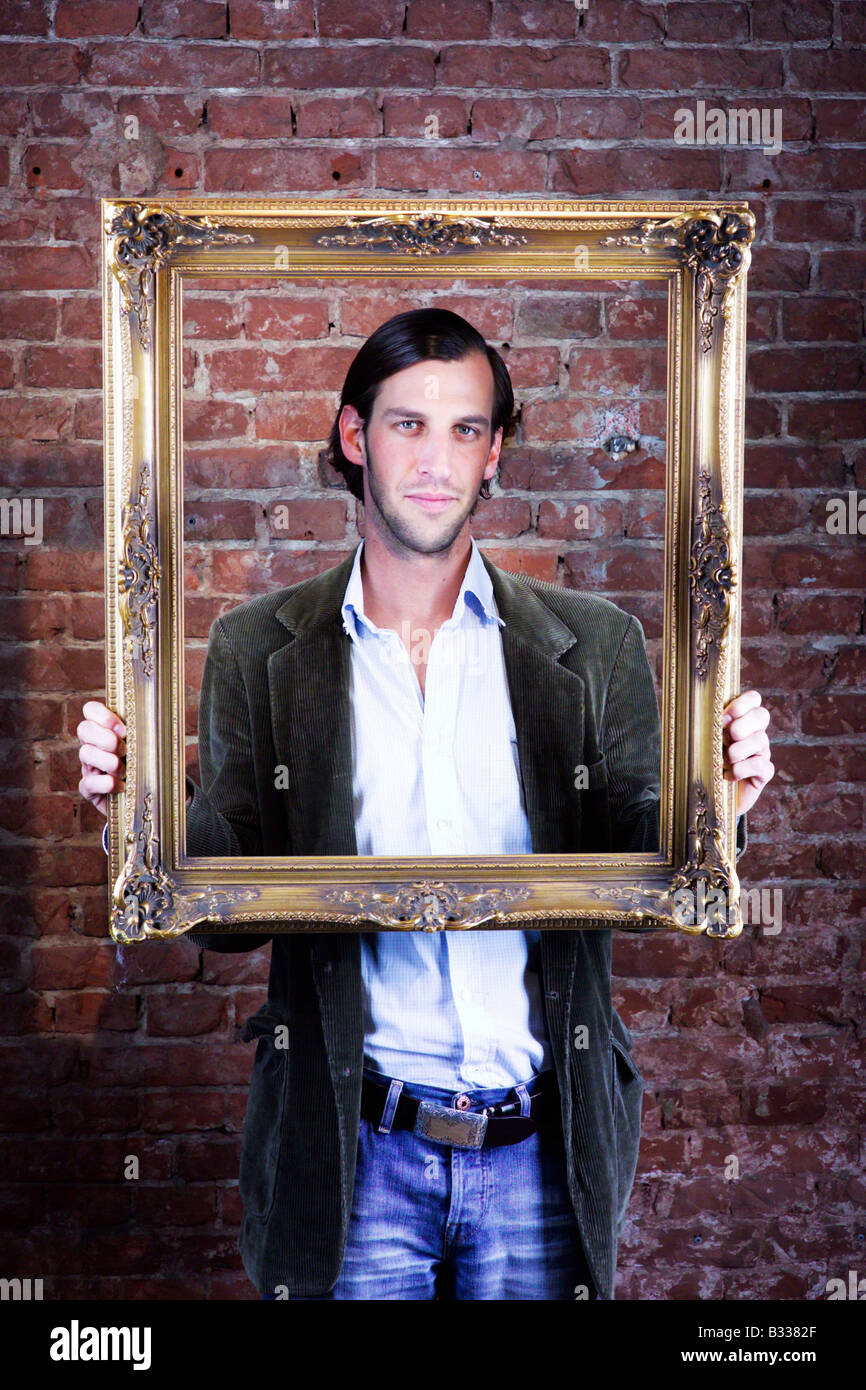 a young man in a picture frame Stock Photo - Alamy