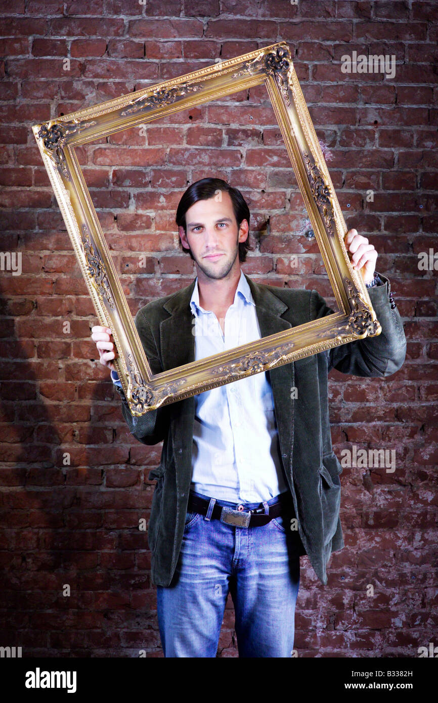 a young man in a picture frame Stock Photo - Alamy