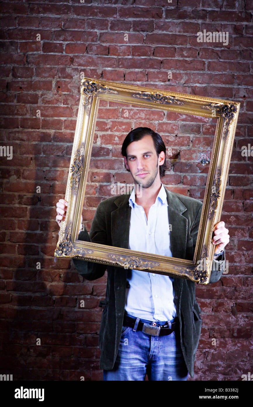 a young man in a picture frame Stock Photo - Alamy