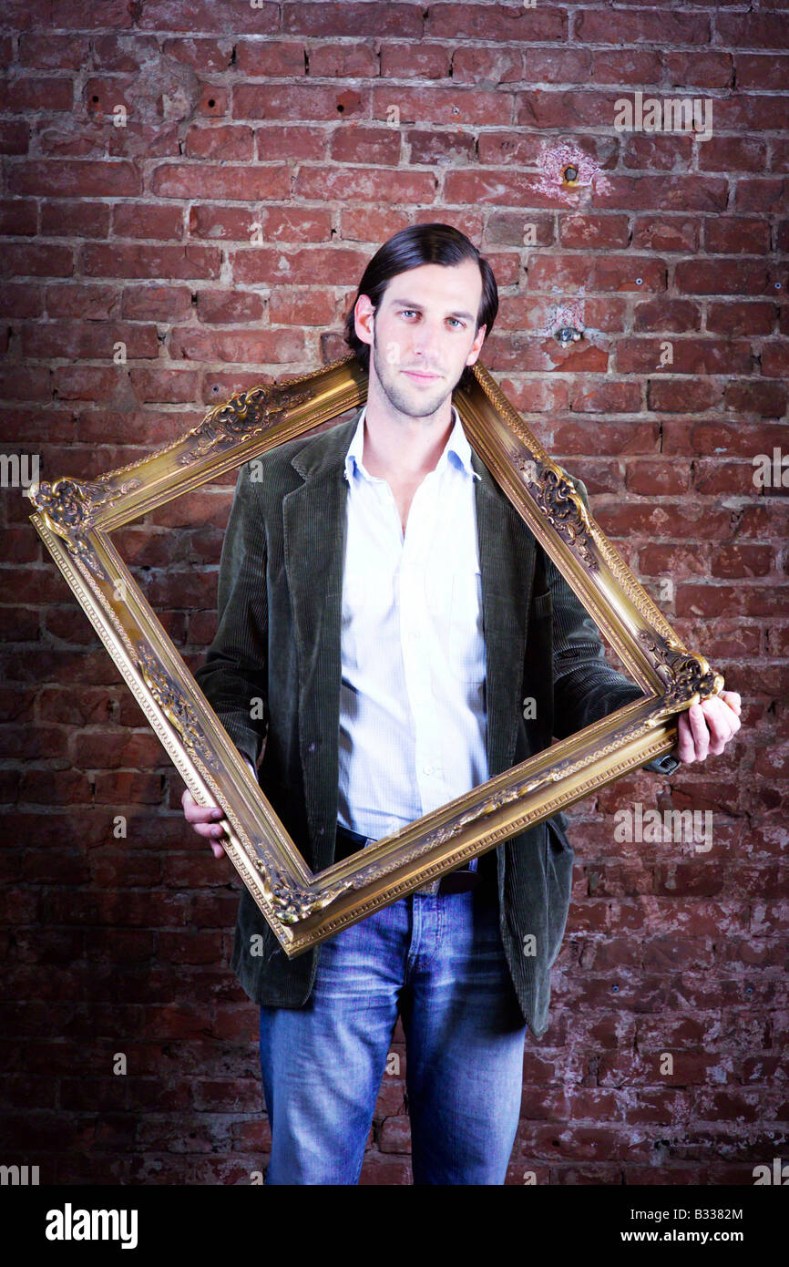 a young man in a picture frame Stock Photo - Alamy