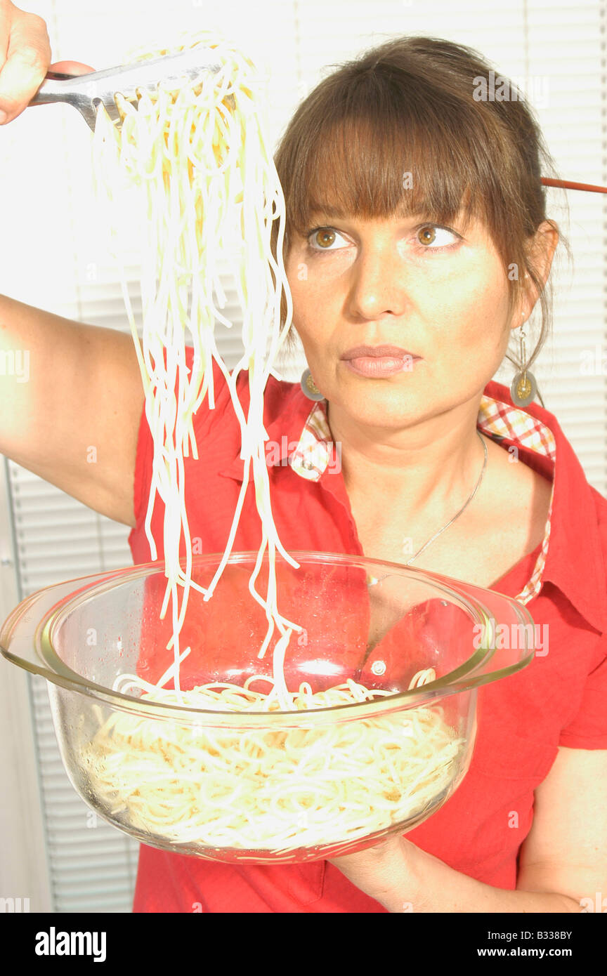 Woman with Spaghetti Stock Photo - Alamy