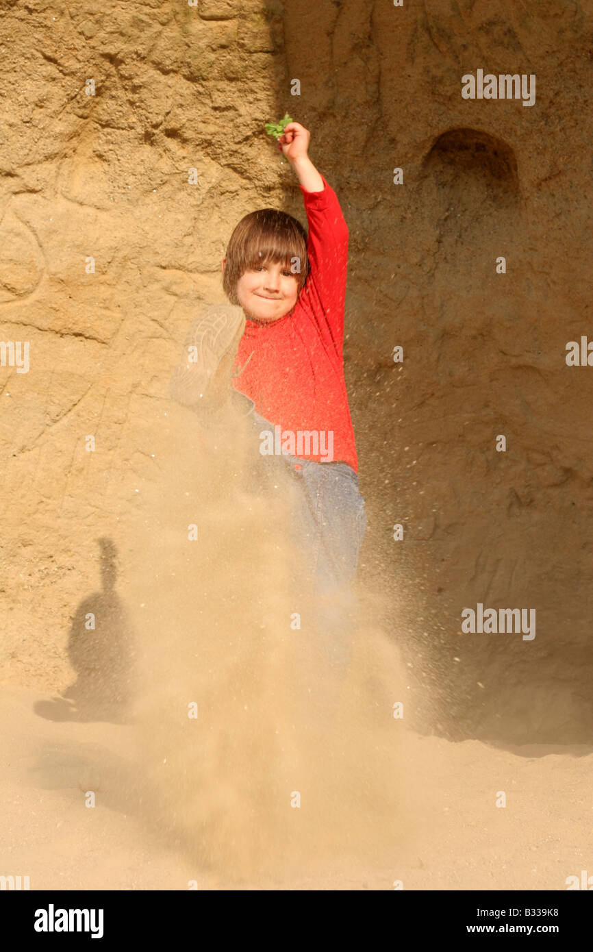 Child plays with sand Stock Photo - Alamy