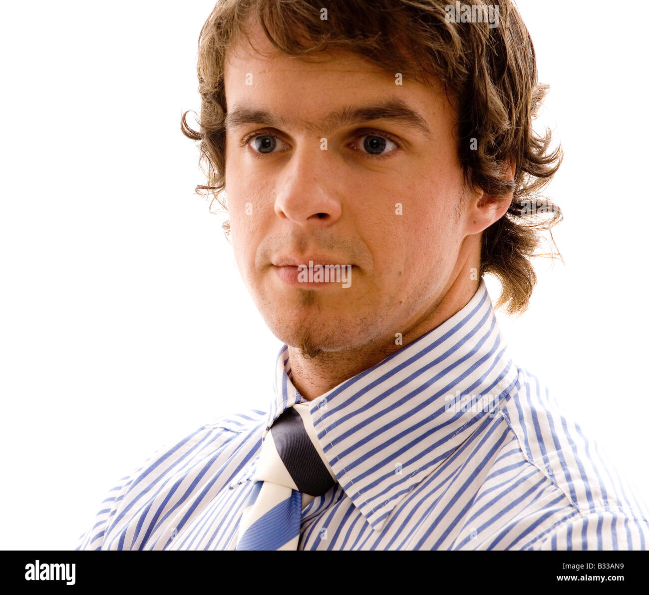 A young businessman looking off camera Stock Photo - Alamy