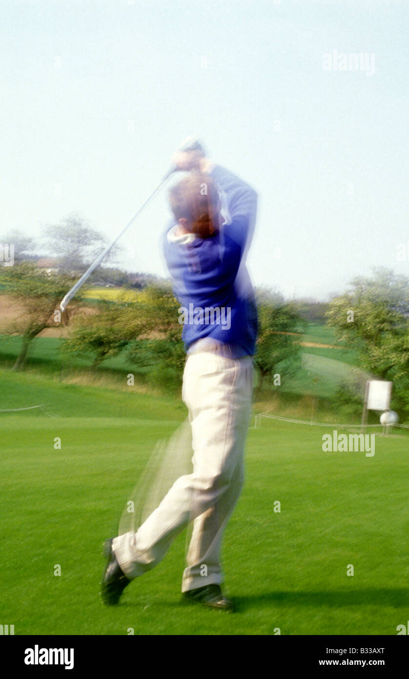 Man gulfing player at tee off Stock Photo - Alamy