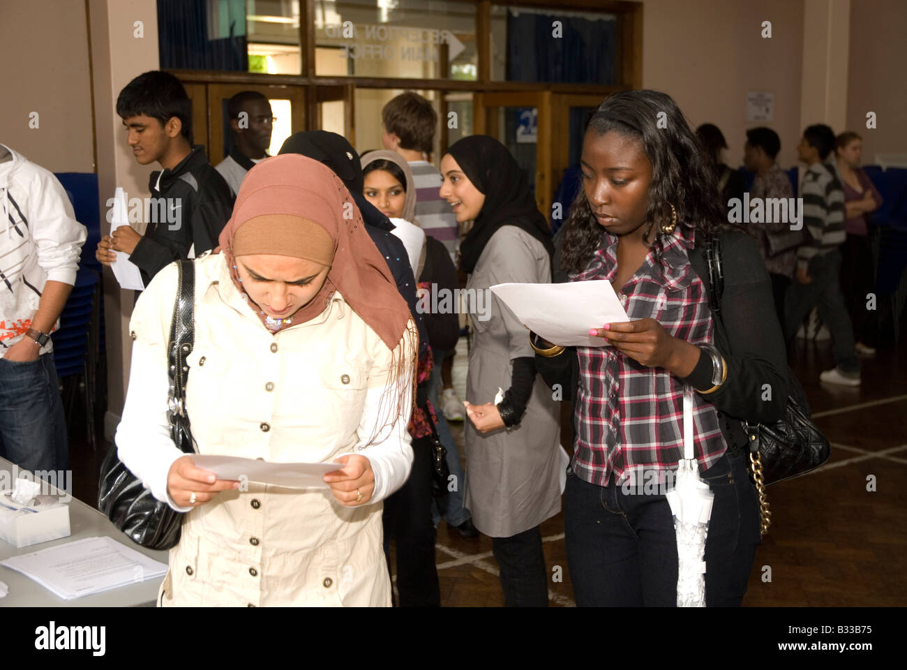 Secondary pupils looking at their GCSE results at school UK Stock Photo ...