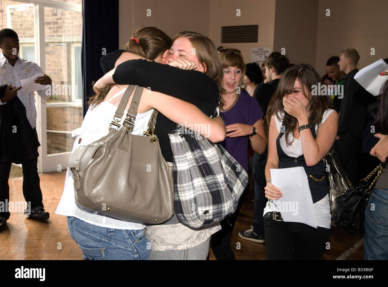 Secondary pupils elated with their GCSE results at school UK Stock ...