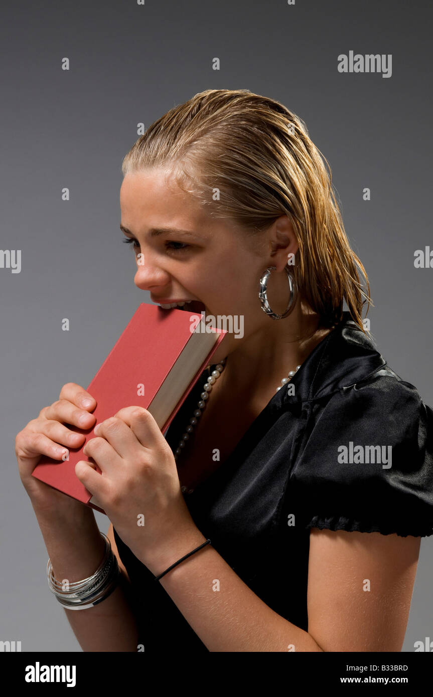 Blond woman with a red book Stock Photo - Alamy