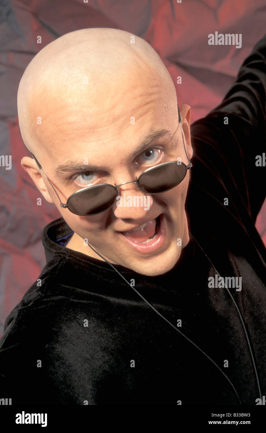 Young man with bald head and sun glasses Stock Photo - Alamy