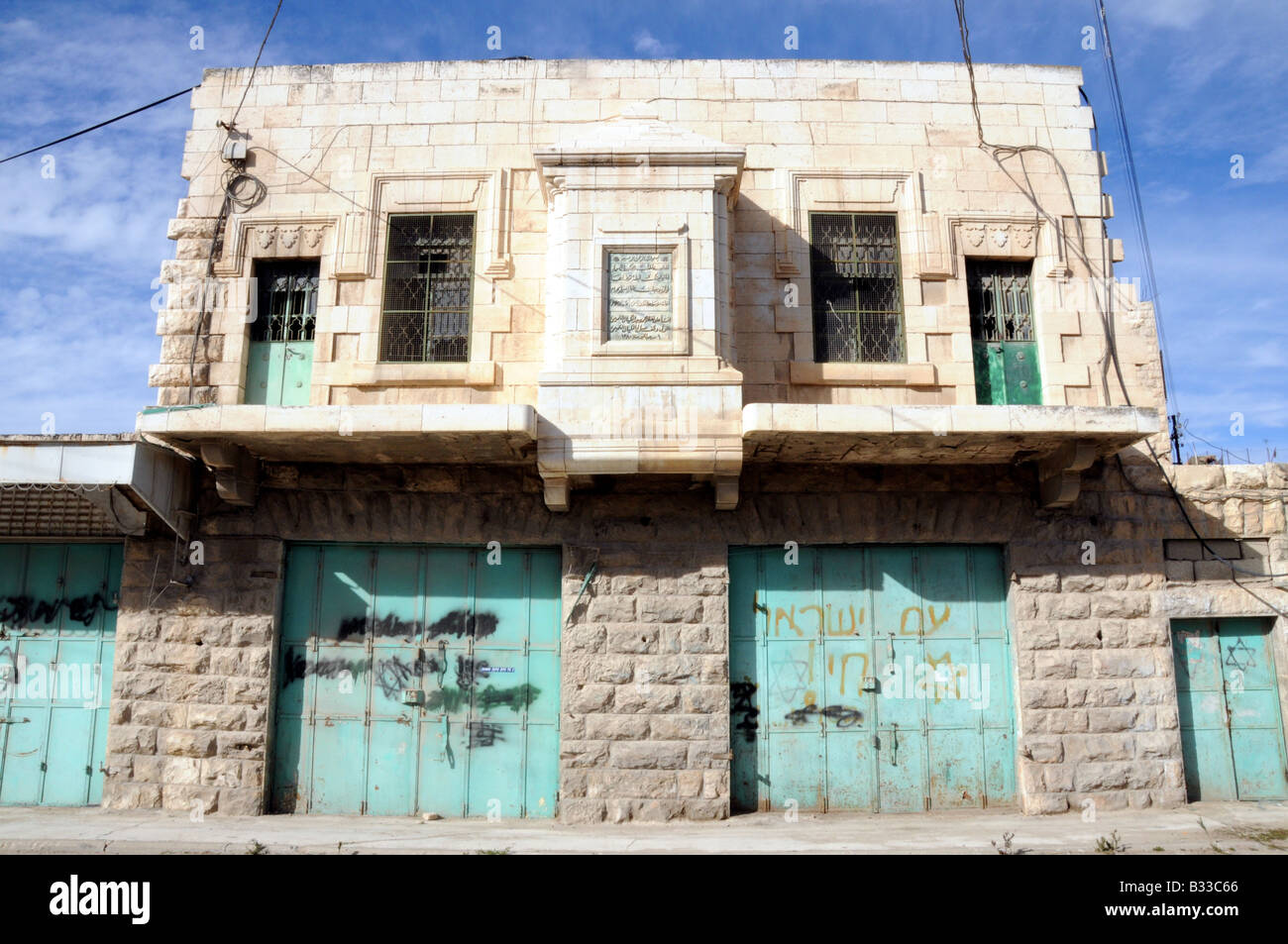 A building in the deserted market area surrounding the disputed Cave of ...