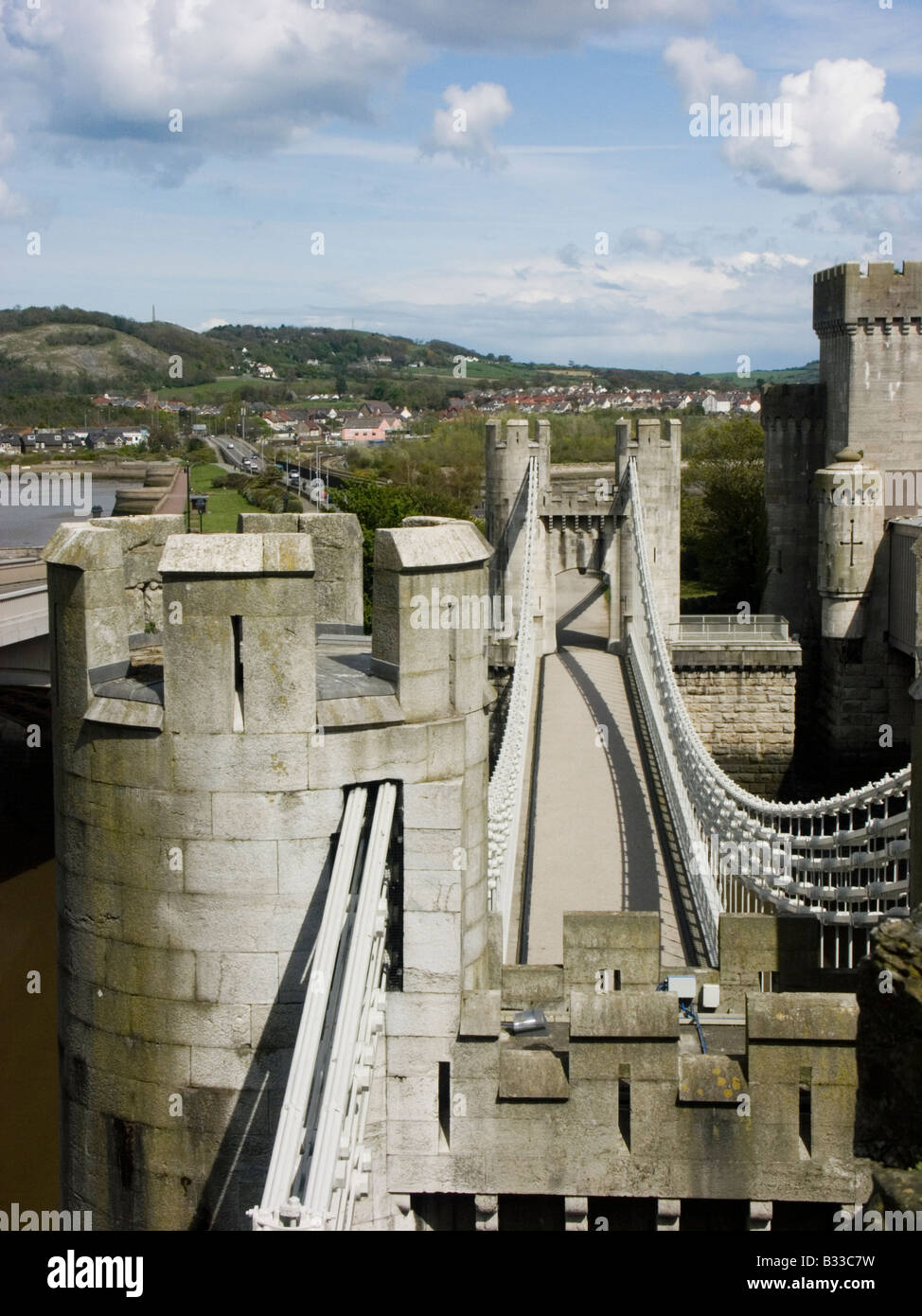 19th century castellated suspension road bridge over the Conwy river ...