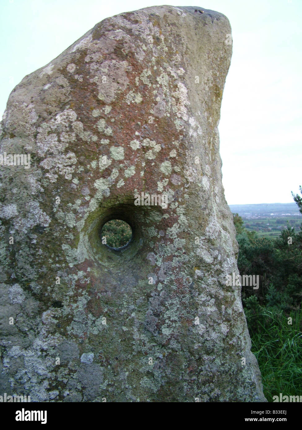 Hole stone near parkgate a mythical marriage stone Stock Photo - Alamy