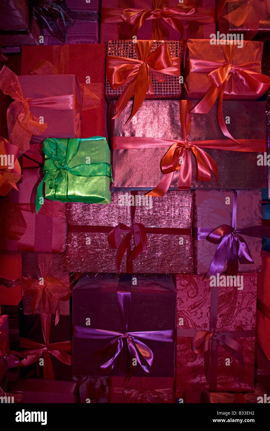 Unique composition of single green wrapped box among an extravagant ...