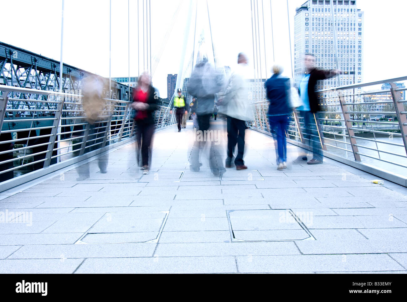Blurred people walking over the bridge Stock Photo - Alamy