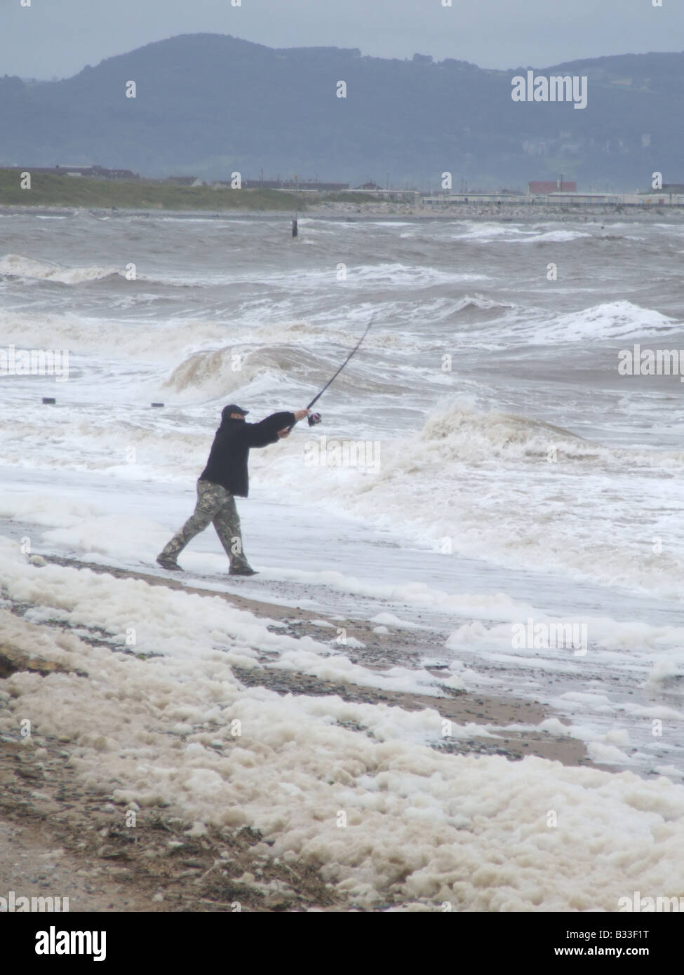 man sea fishing in rhyl in north wales Stock Photo - Alamy