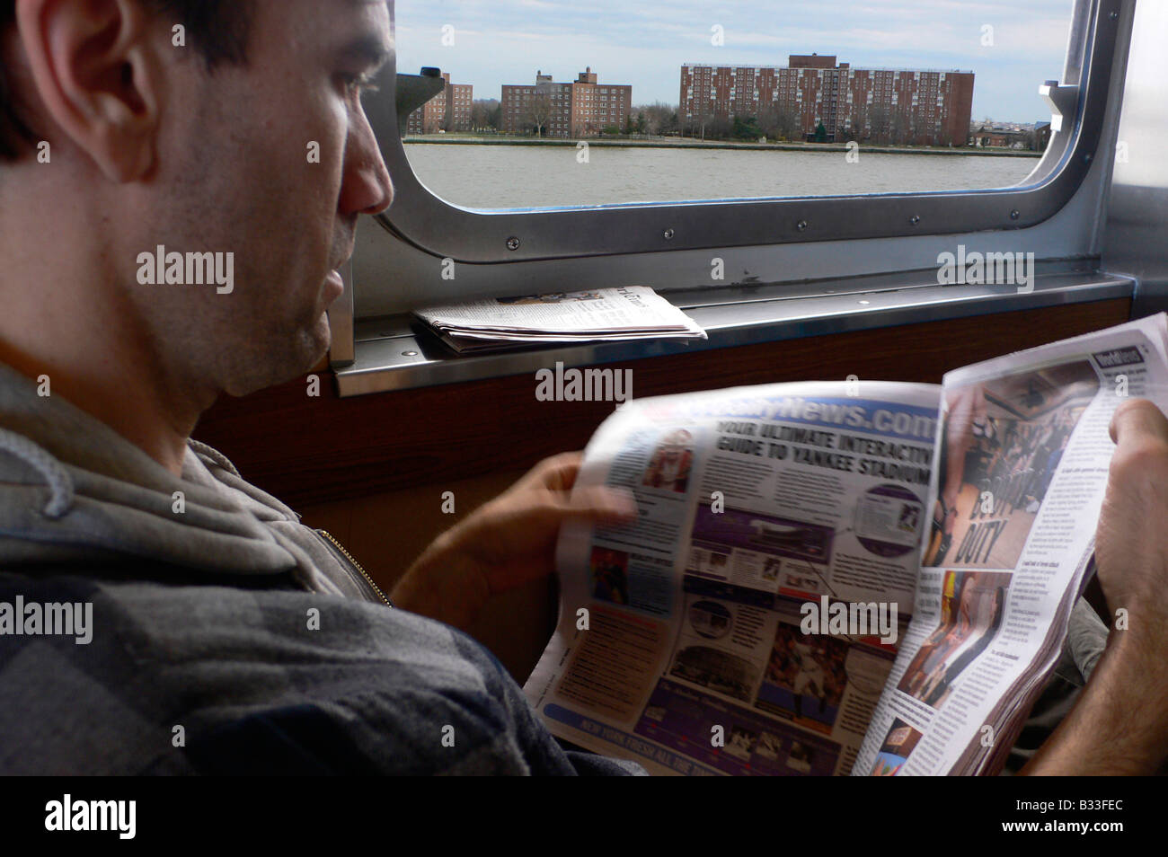 Reading new paper hi-res stock photography and images - Alamy