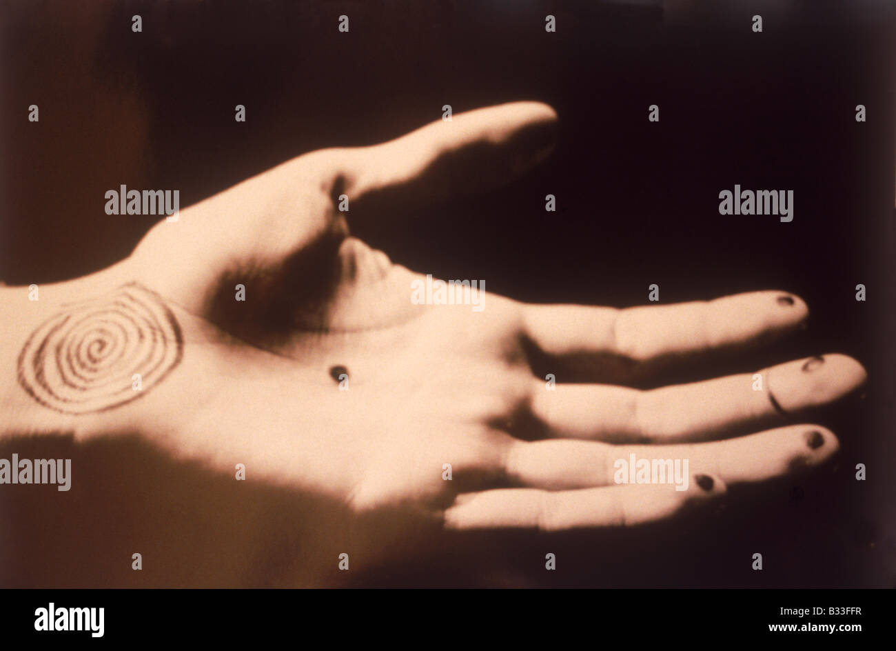 Ghostly ethereal open hand in offering gesture with mysterious spiral ...