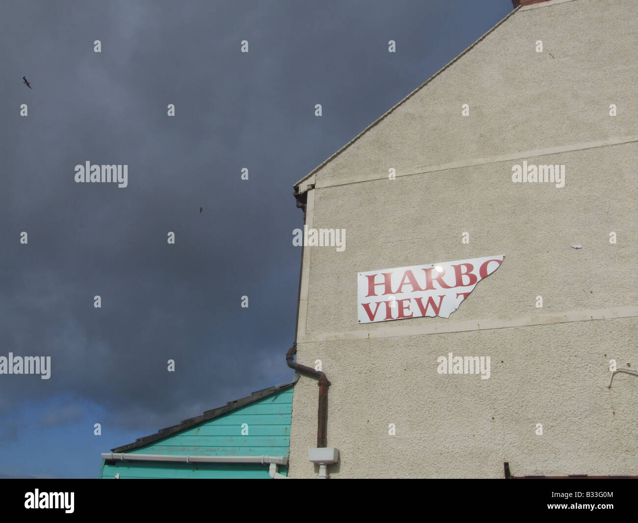 damaged sign notice on holiday hotel business by resort Stock Photo - Alamy