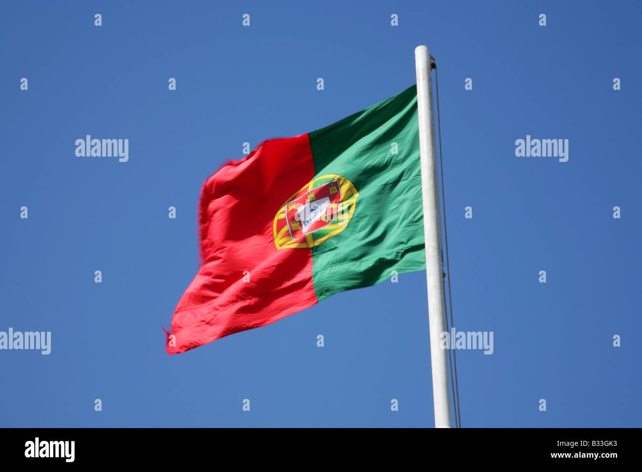Portuguese flag flying in the breeze. Lisbon, Portugal Stock Photo - Alamy