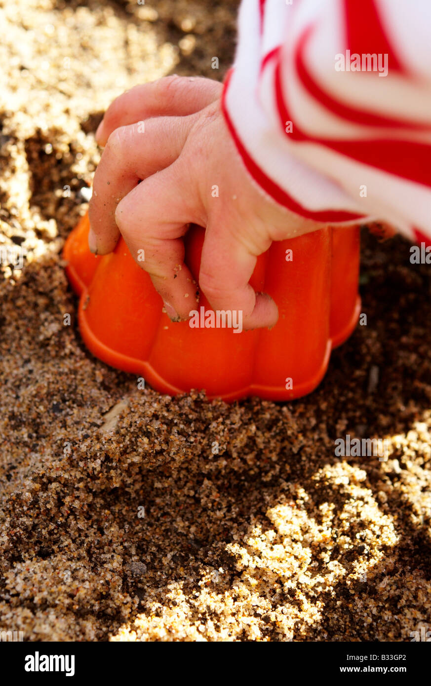 Making sand cakes Stock Photo - Alamy