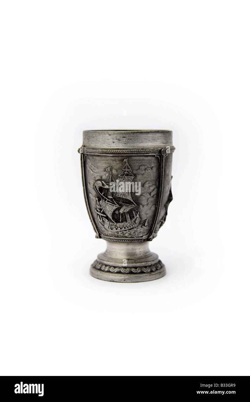 Small goblet with embossed ship decoration, white background Stock ...
