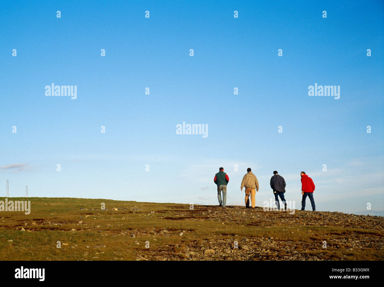 Four men stand hi-res stock photography and images - Alamy