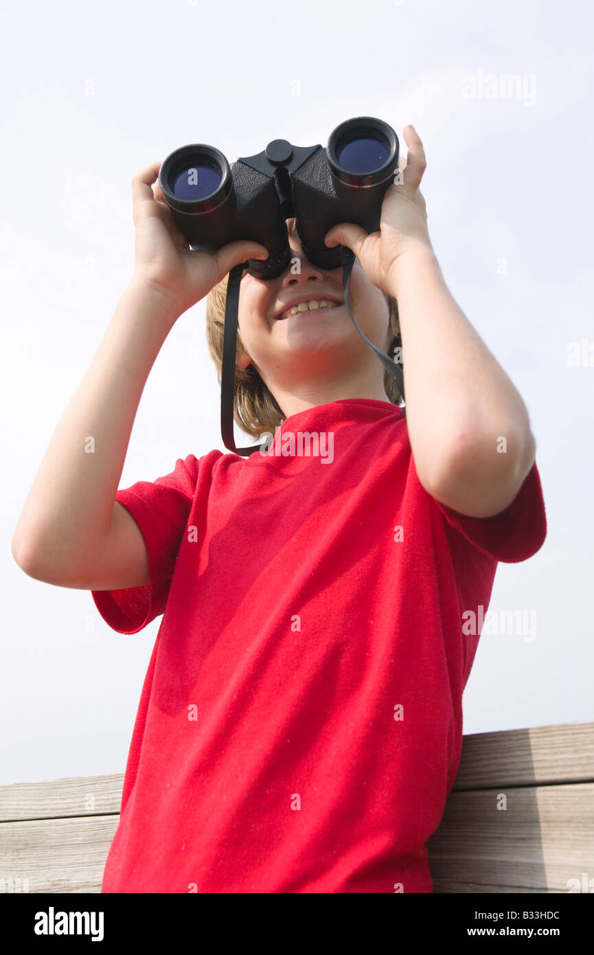Boy using Binoculars Stock Photo - Alamy