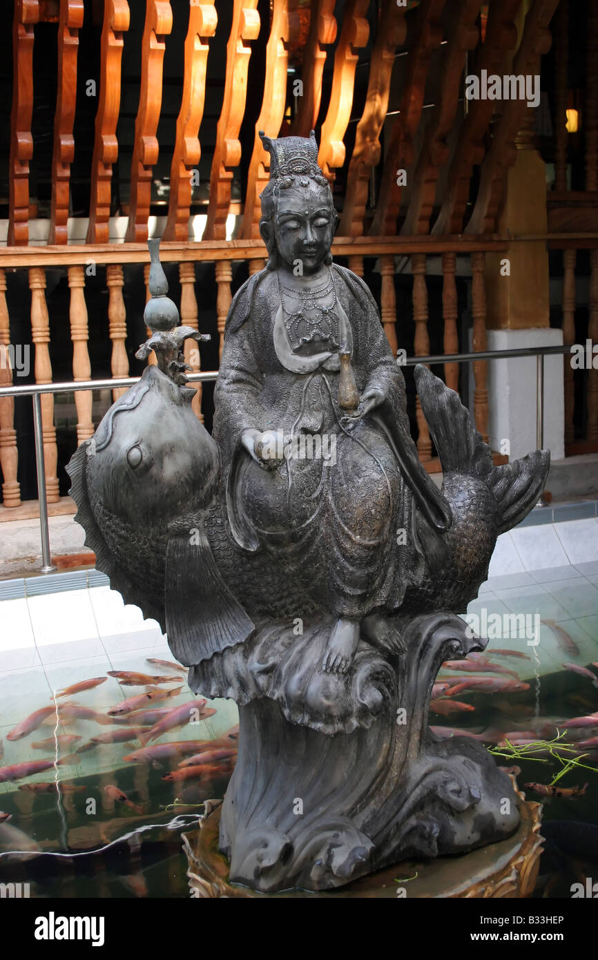 Buddha statue on a fish in a pond in the Asokaramaya temple in Colombo ...