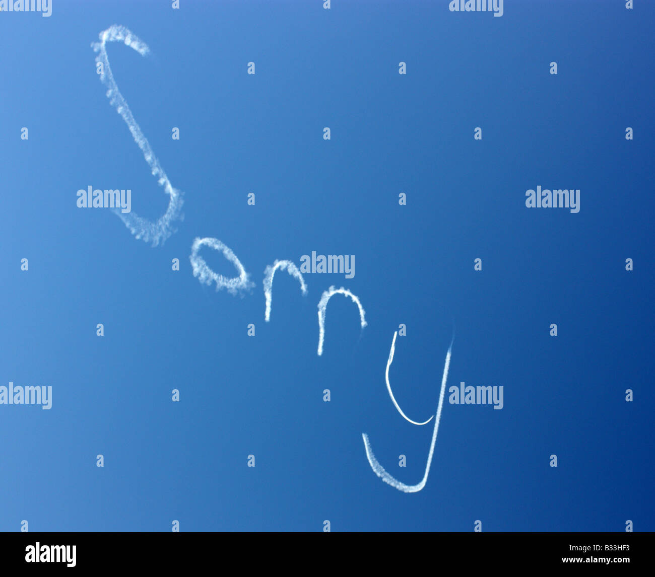 SORRY WRITTEN IN THE SKY BY A VAPOUR TRAIL FROM A JET PLANE HORIZONTAL ...