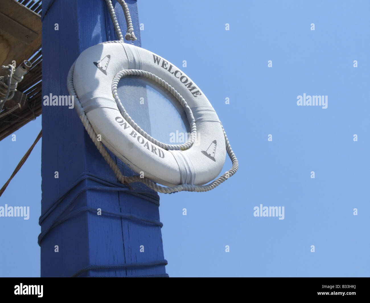 ornamental life saving rubber ring on ship and blue sky Stock Photo - Alamy