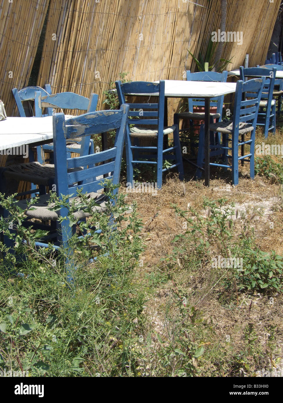 chairs and tables in closed outside restaurant Stock Photo - Alamy