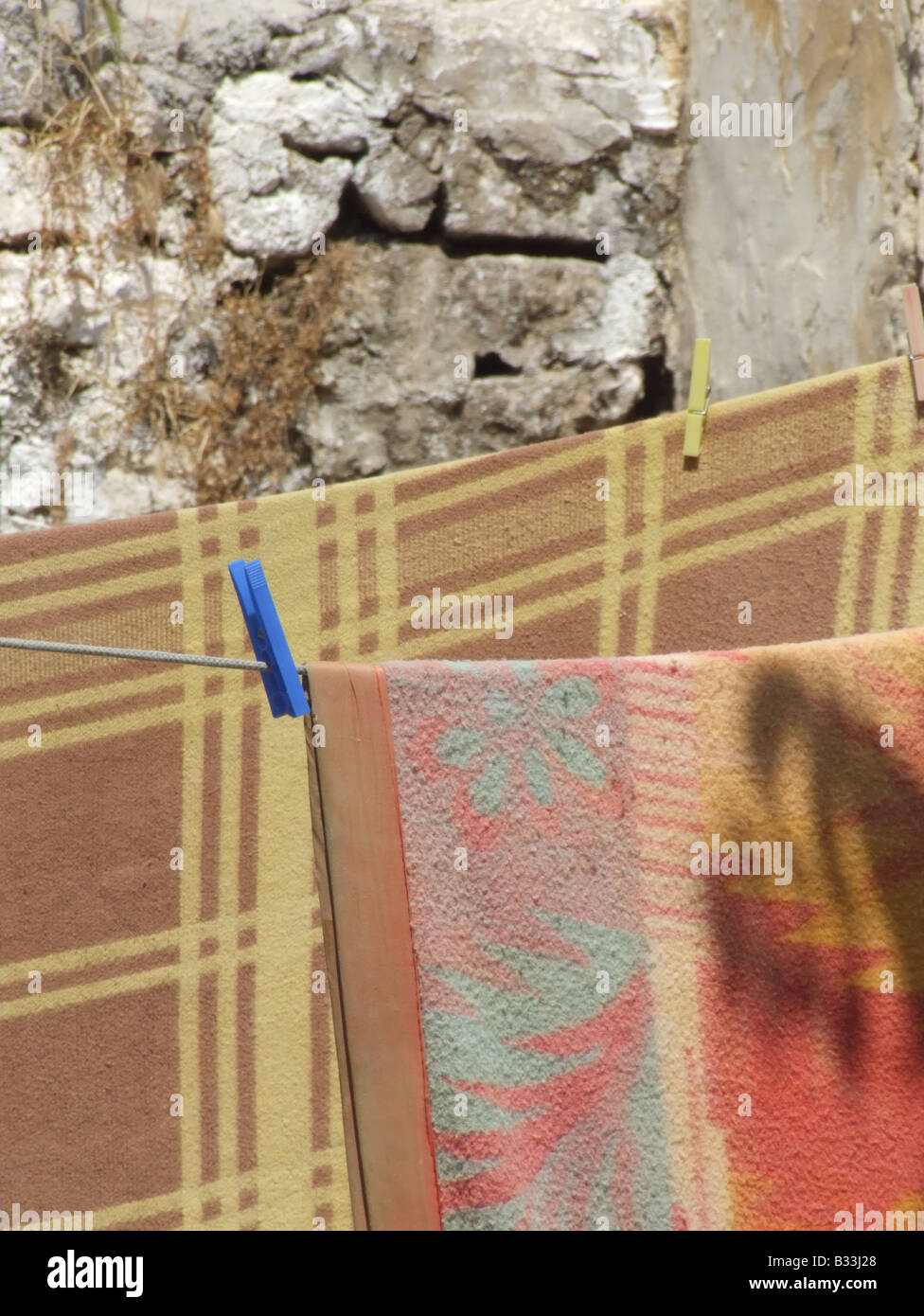 two blankets on washing line in sun outdoors Stock Photo - Alamy