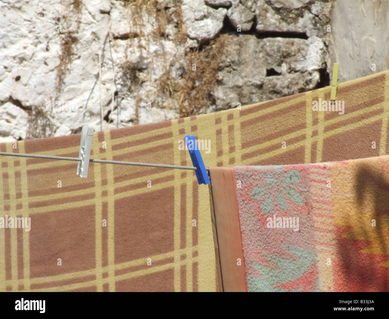 two blankets on washing line in sun outdoors Stock Photo - Alamy