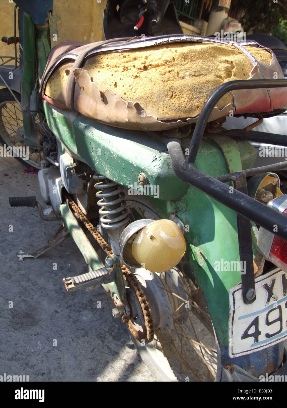 old damaged moped scooter in street in sun Stock Photo - Alamy