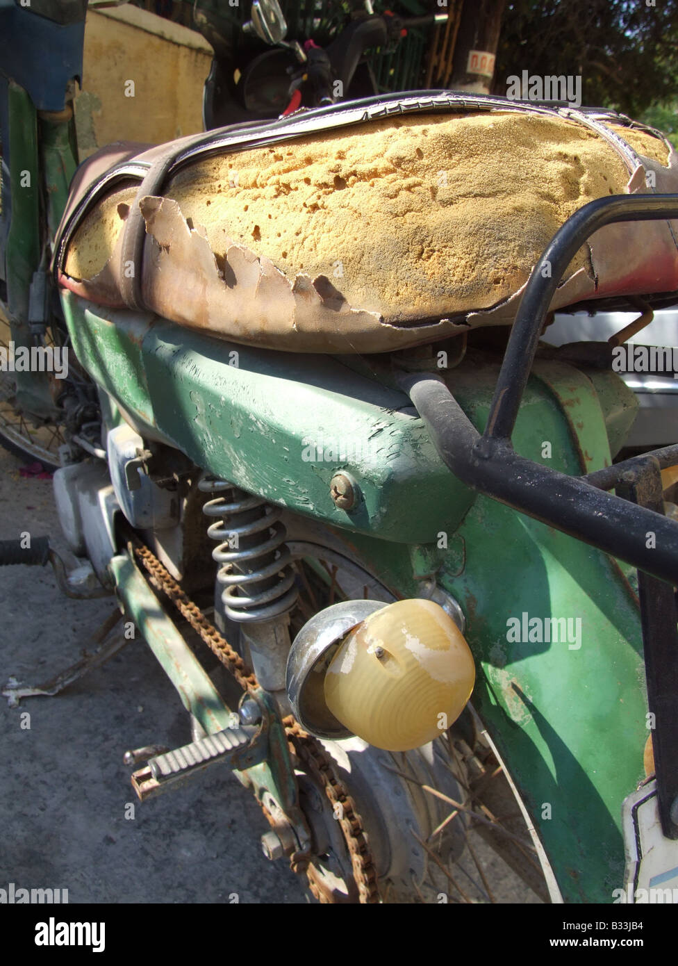 old damaged moped scooter in street in sun Stock Photo - Alamy
