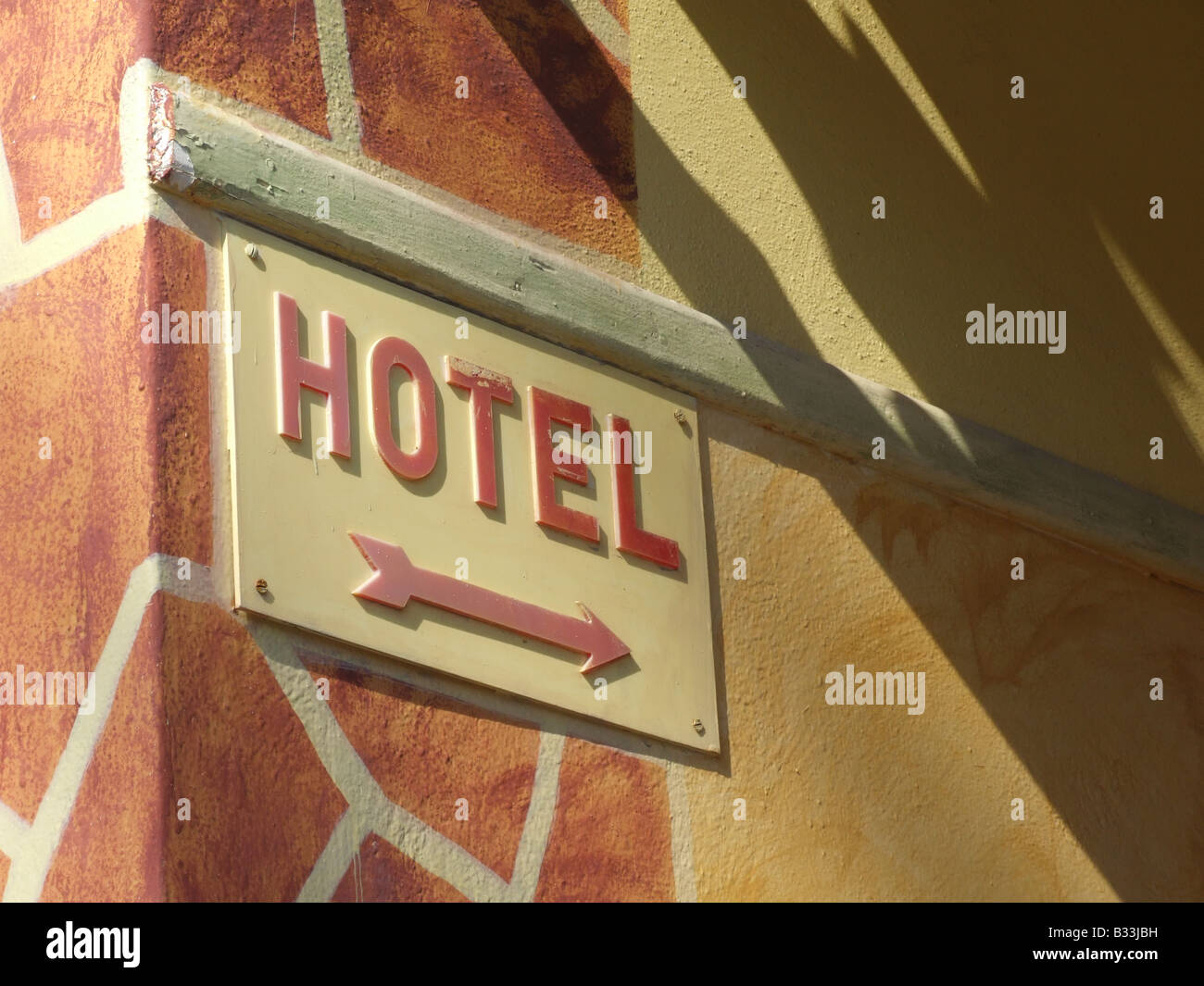 hotel sign notice on building wall in sun Stock Photo - Alamy