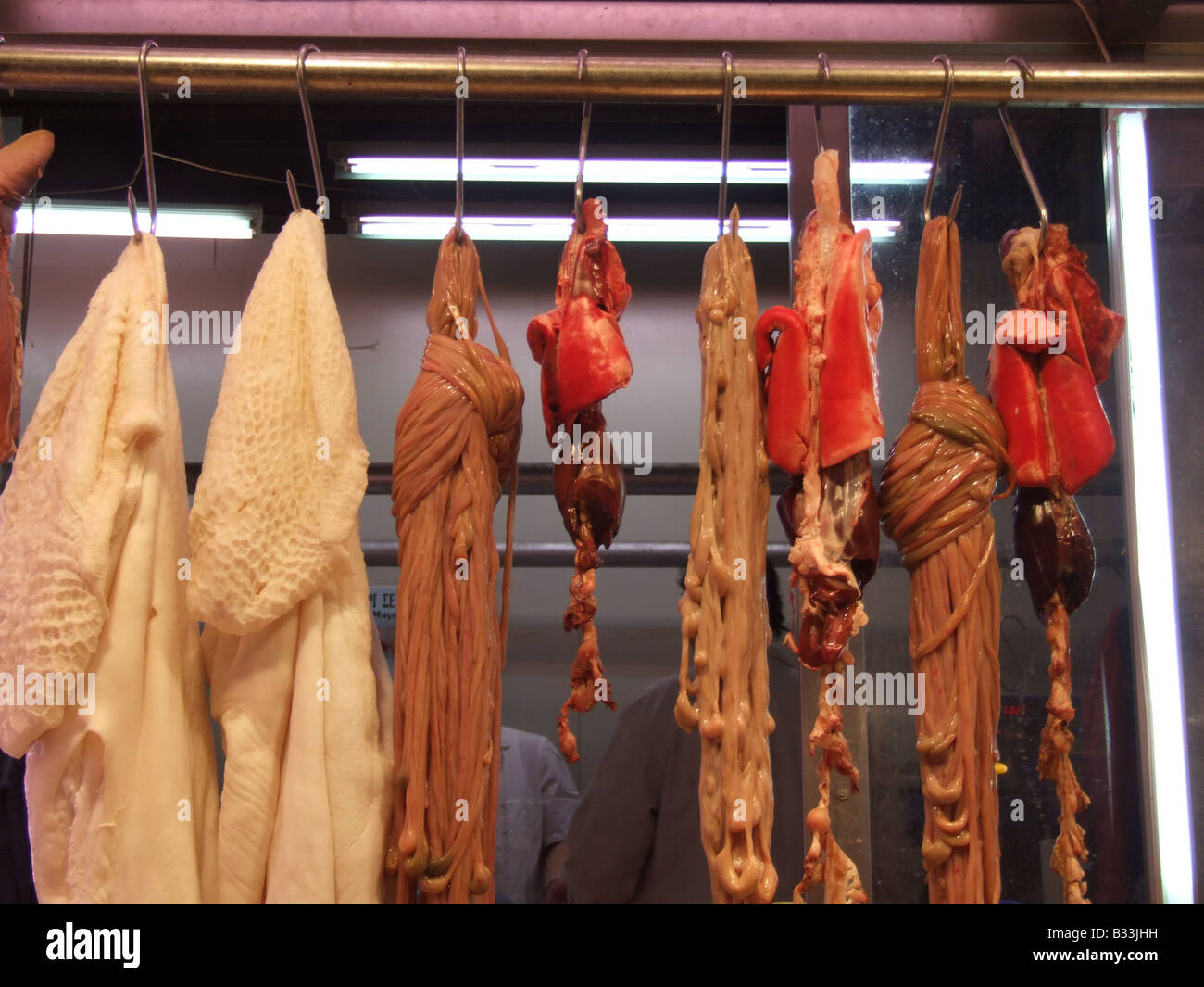 hanging meat on market stall in athens greece Stock Photo - Alamy