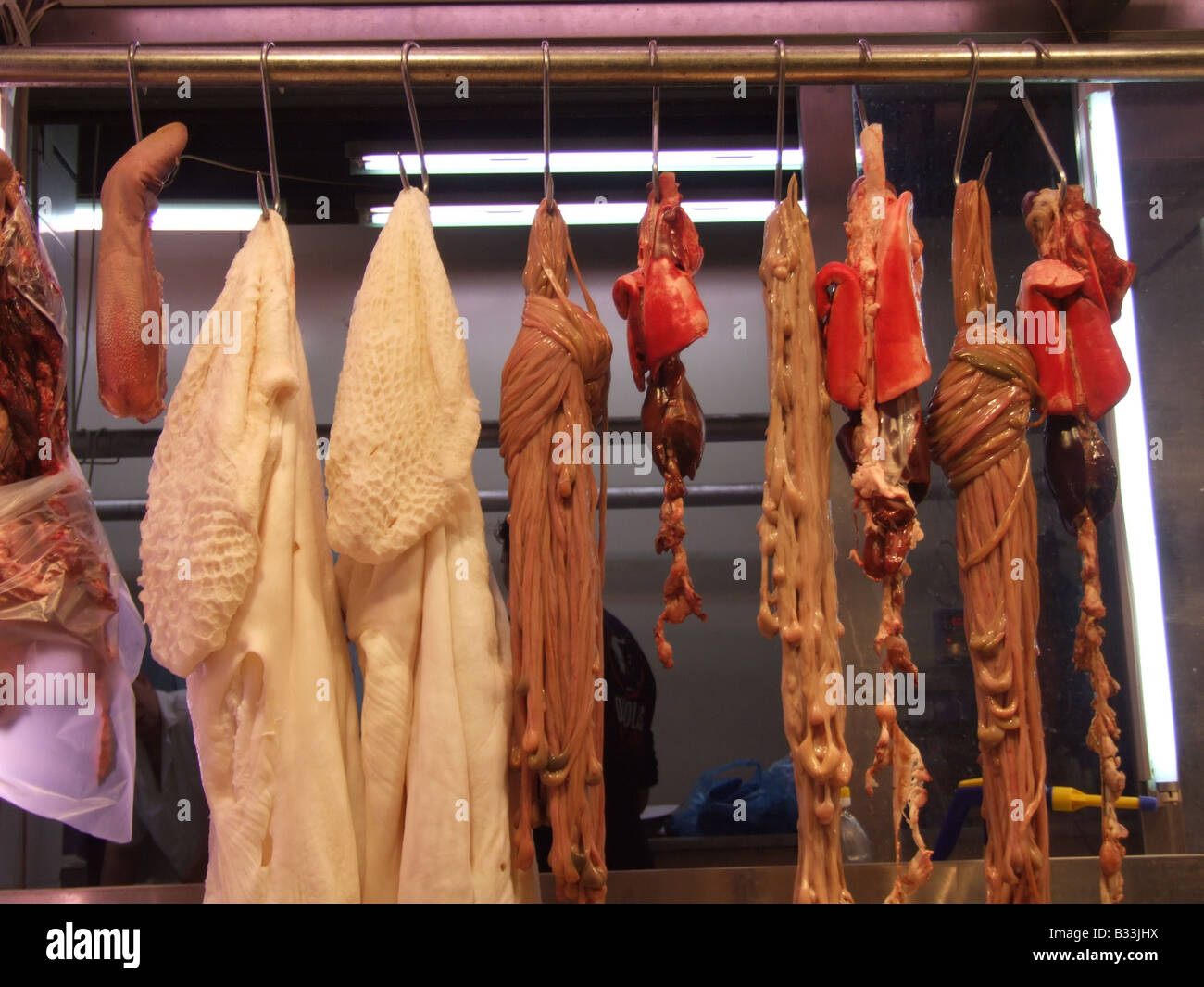 hanging meat on market stall in athens greece Stock Photo - Alamy