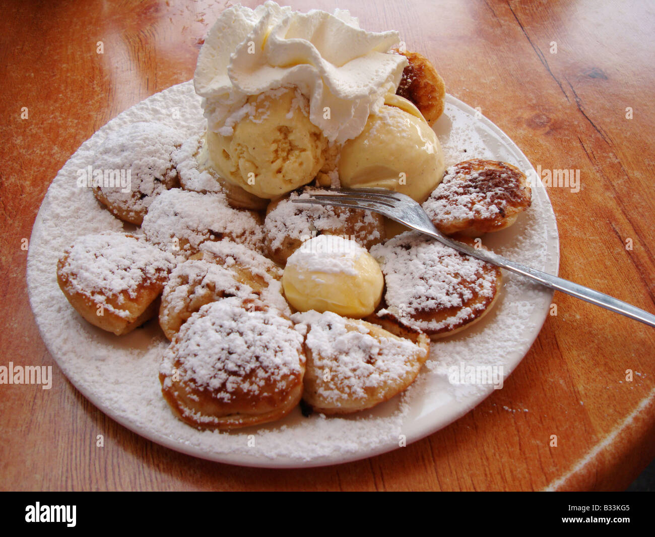 small sugary pancakes, called "poffertjes", a Dutch treat often eaten ...