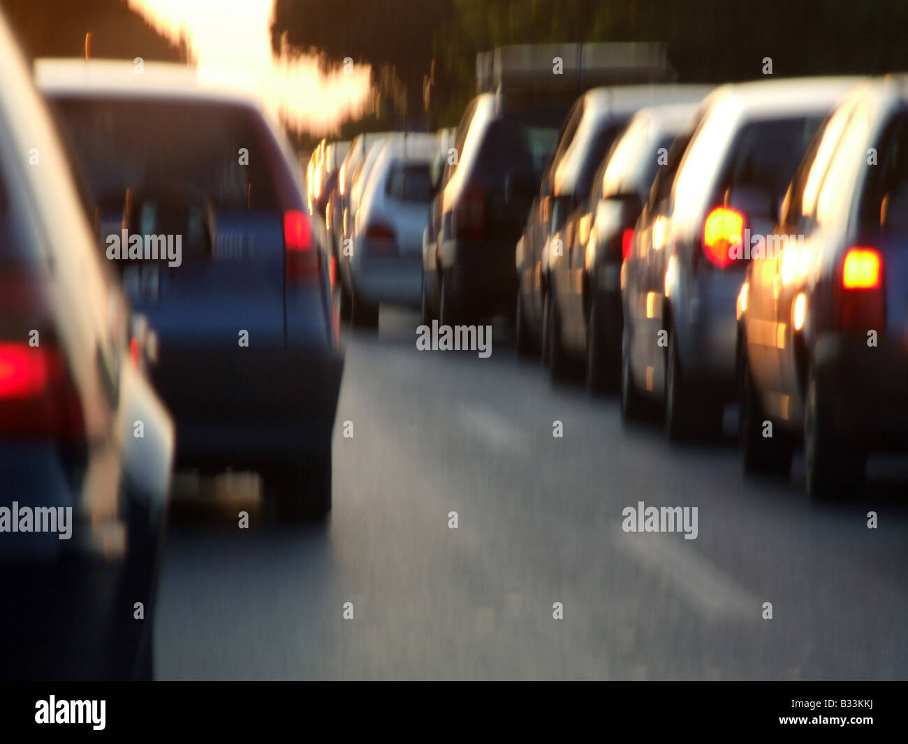 cars in traffic jam on road at sunset Stock Photo - Alamy