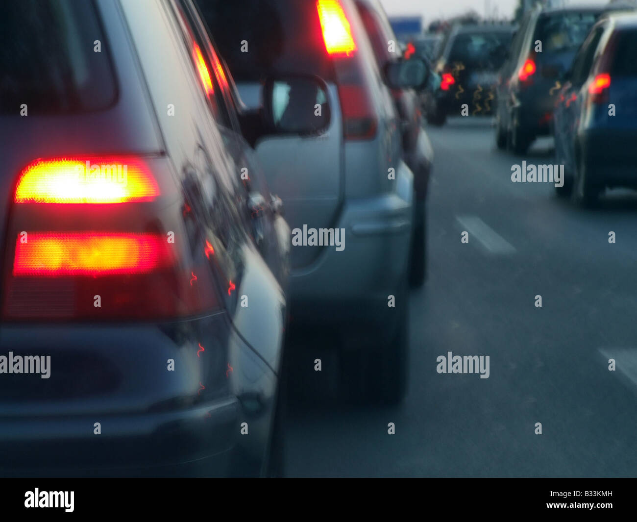 cars in traffic jam on road at sunset Stock Photo - Alamy
