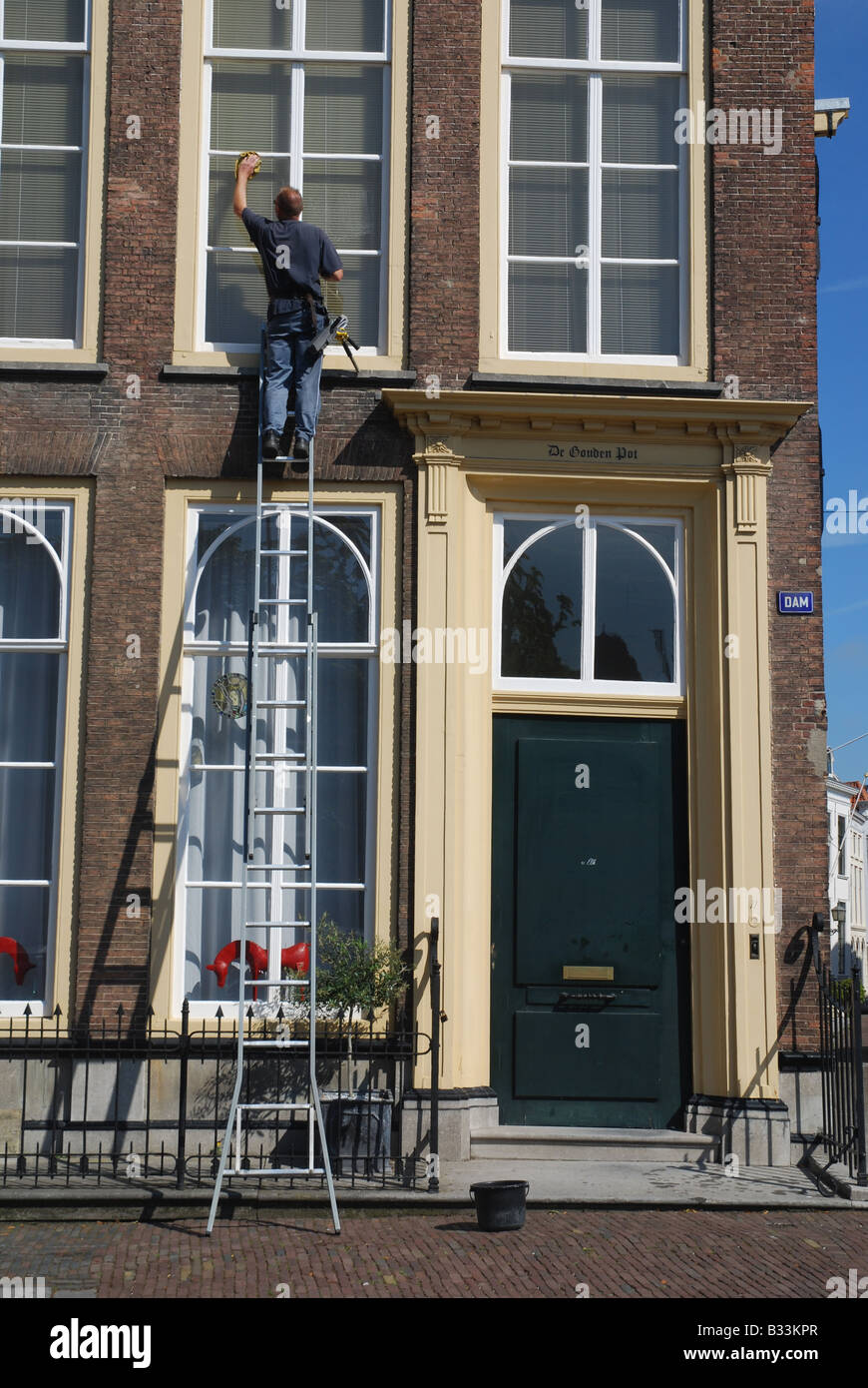 window cleaner at work in centre of Middelburg Zeeland Netherlands ...