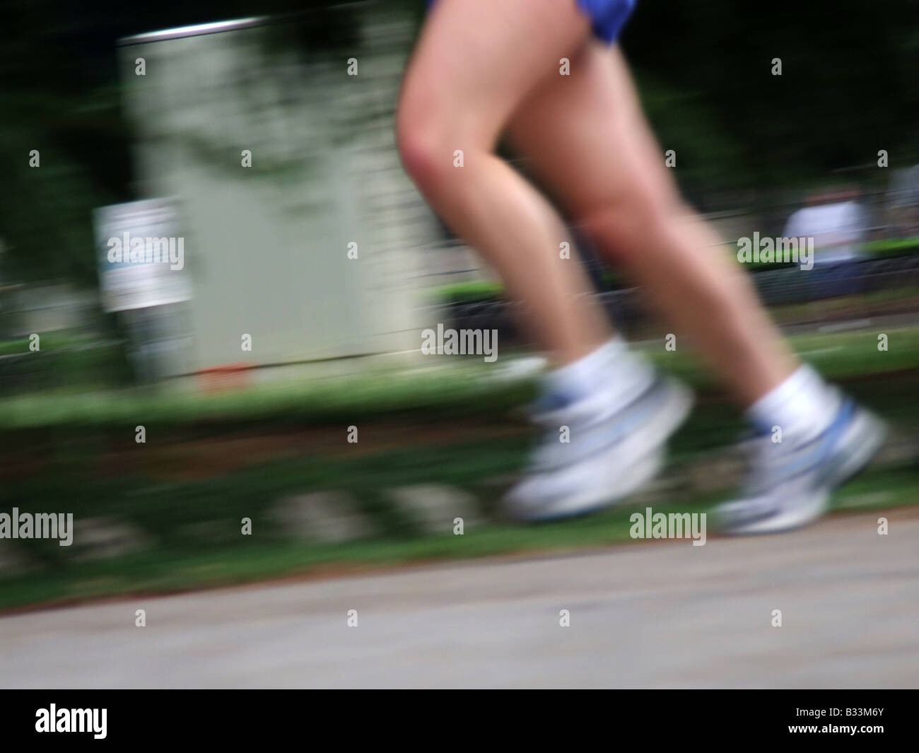 abstract feet of fast runner in park Stock Photo - Alamy