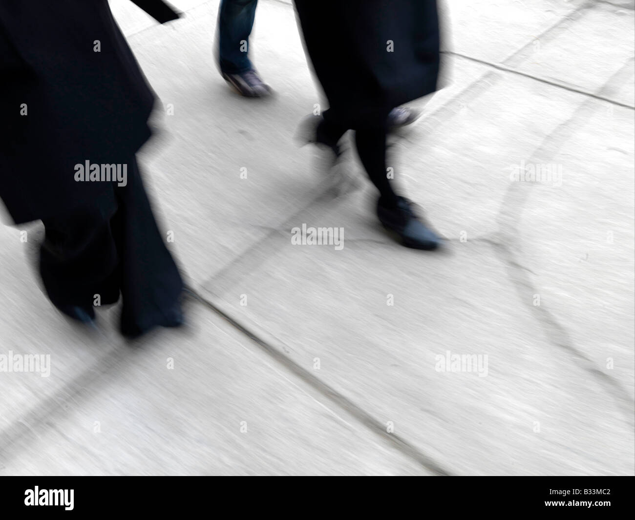 A view of women shoes while walking down a paved sidewalk Stock Photo ...