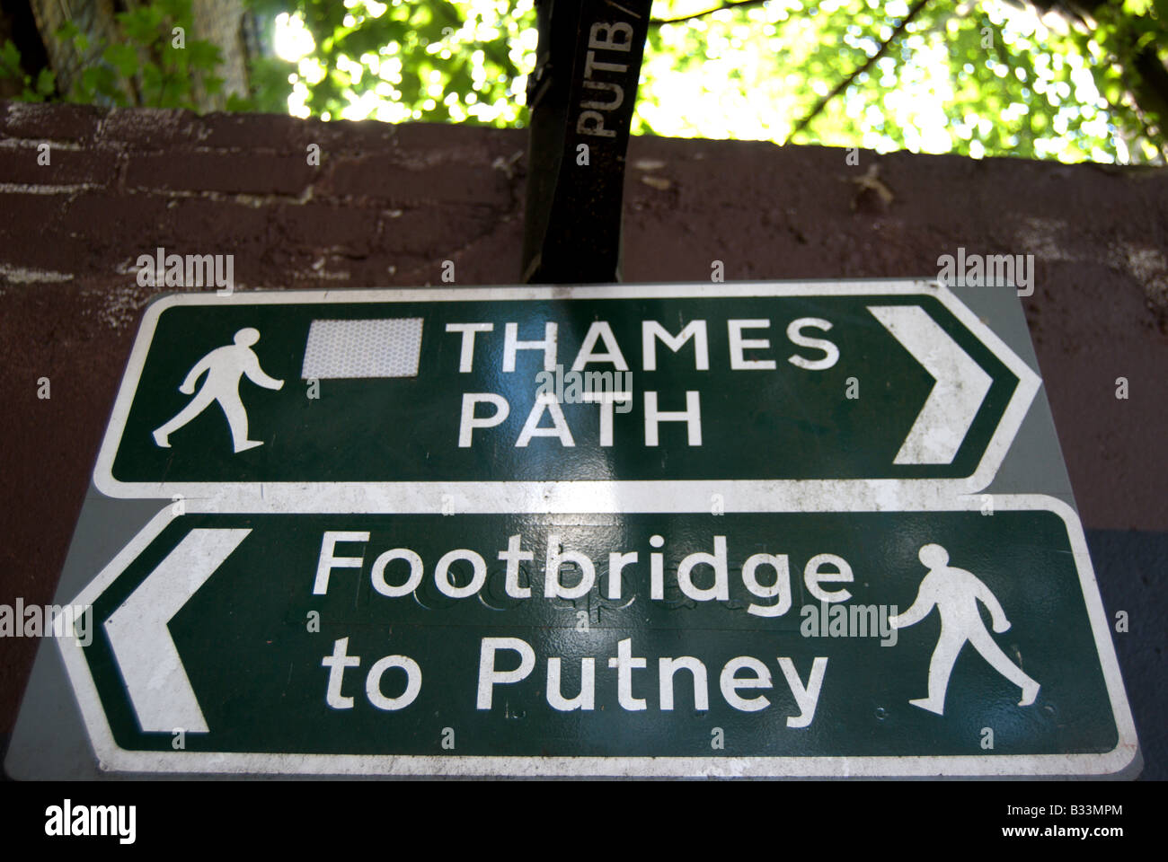 thames path and footbridge to putney signs in fulham, southwest london ...