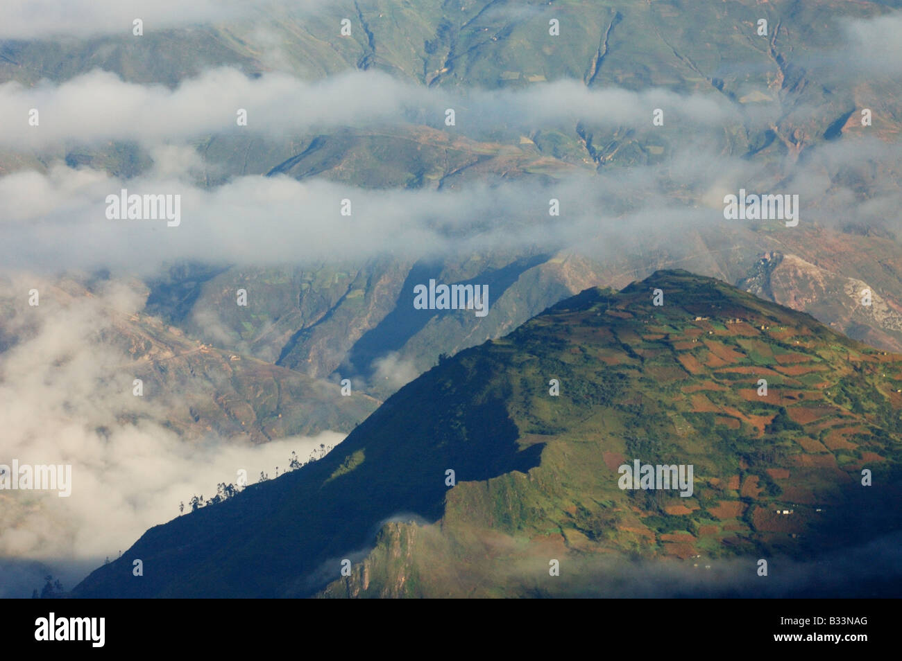 Foothills in the clouds seen from Laguna Chillata near Mt Illampu ...