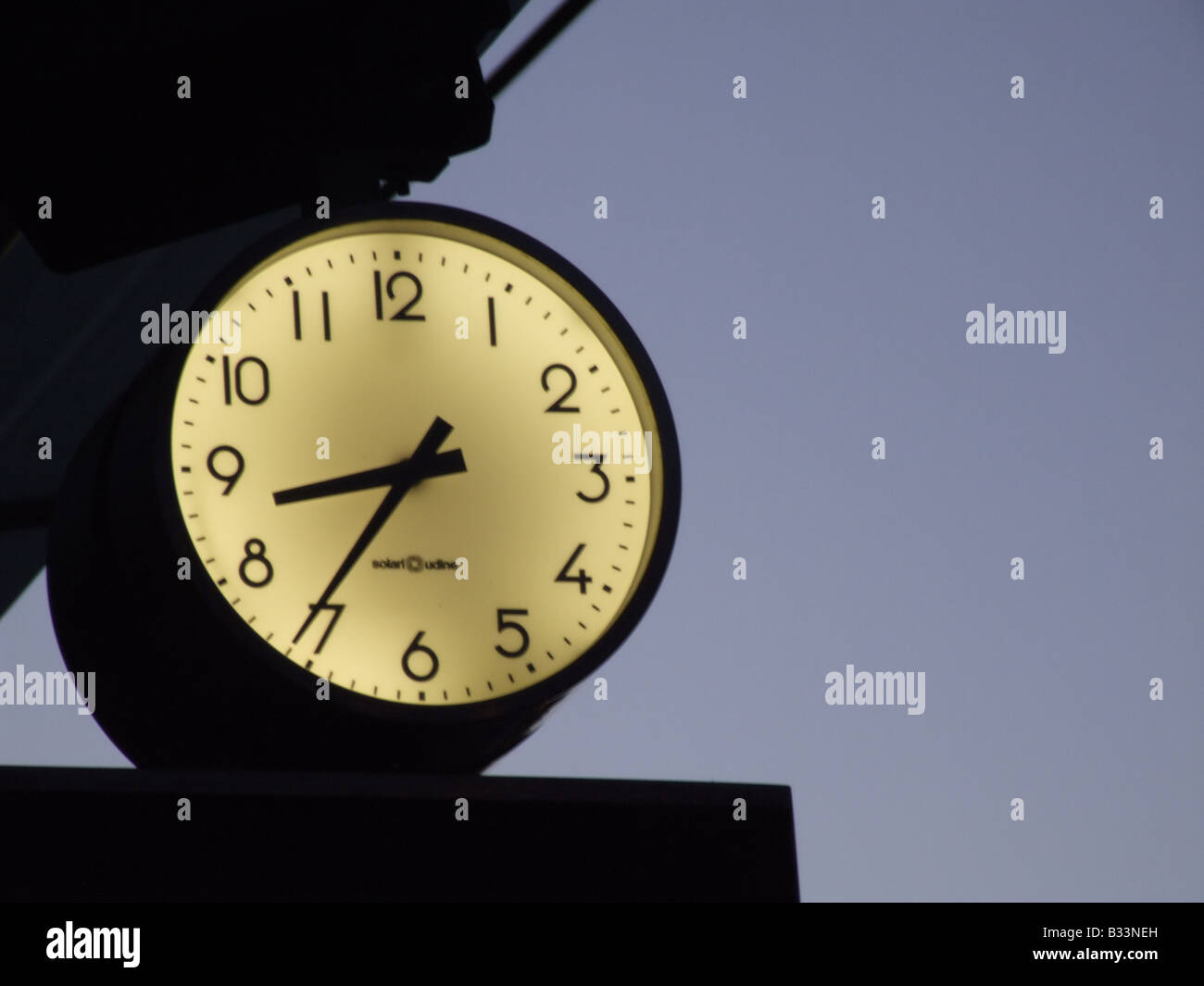 clock in city at night Stock Photo - Alamy