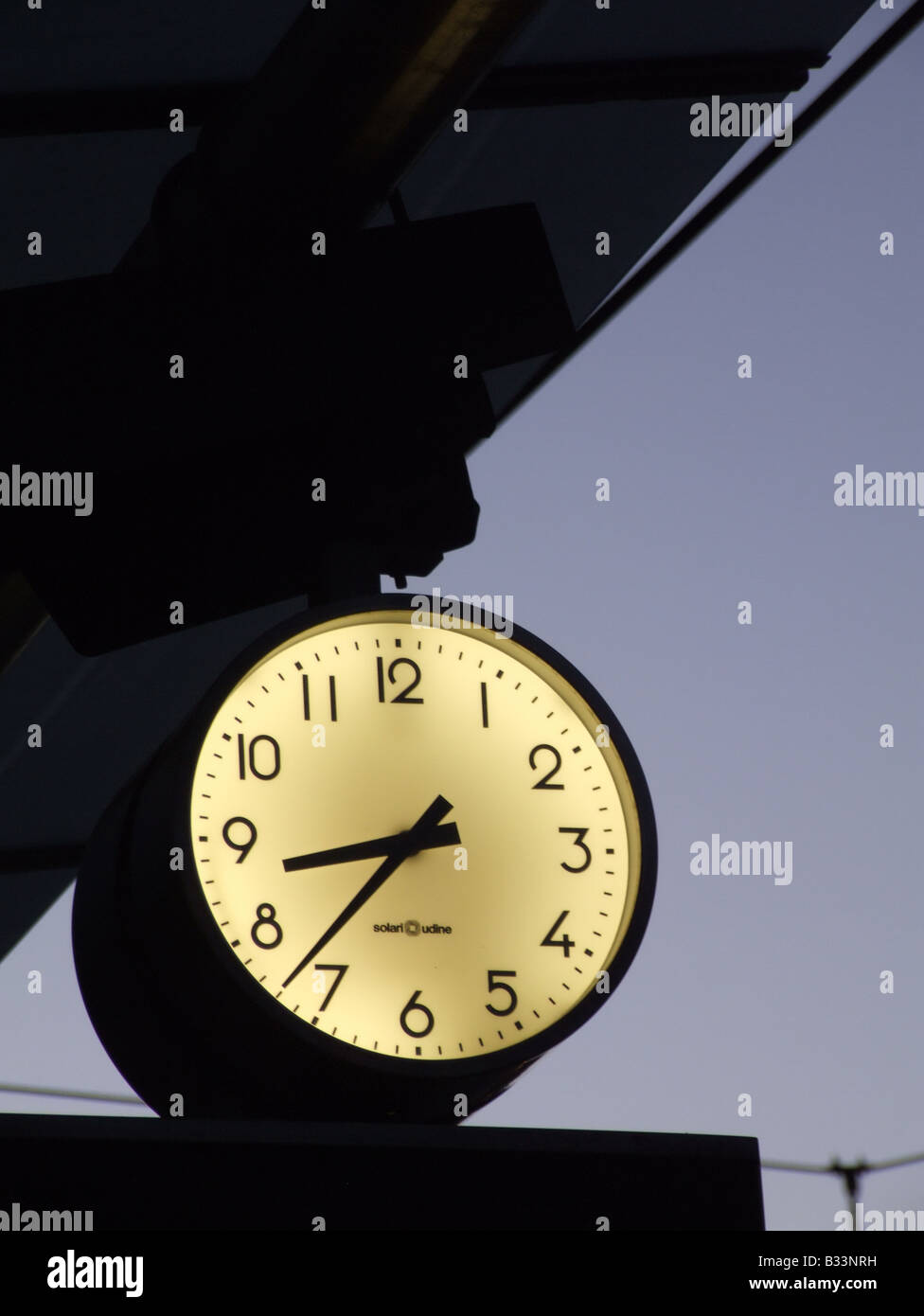 clock in city at night Stock Photo - Alamy