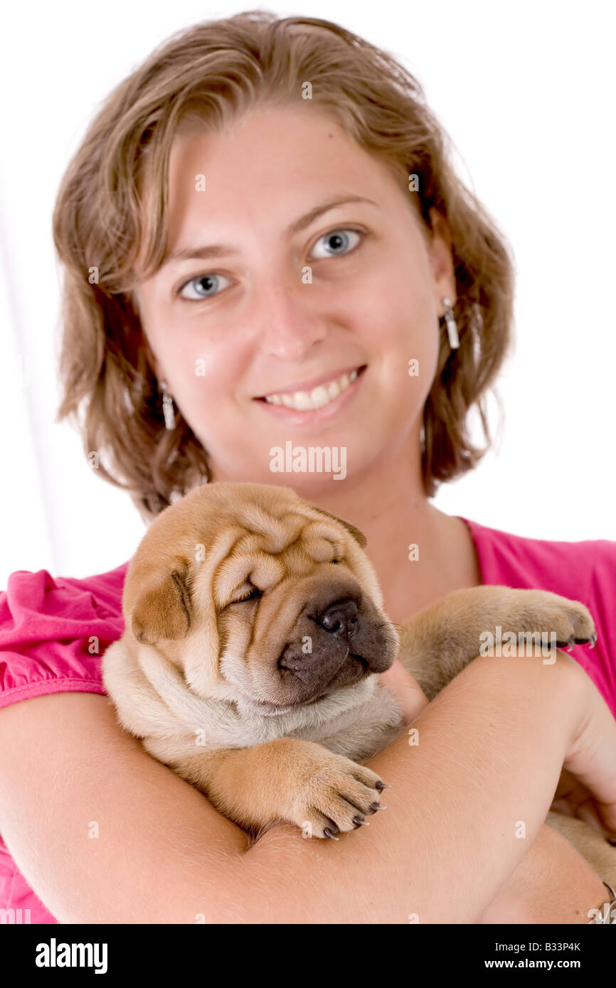 Happy owner of a baby Shar Pei dog, almost one month old Stock Photo ...
