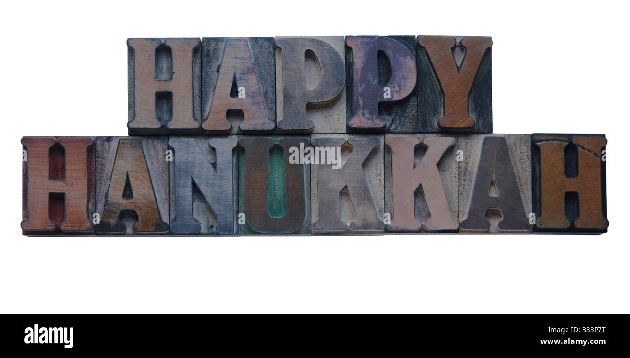 the words 'happy hanukkah' in old, ink-stained wood type Stock Photo ...